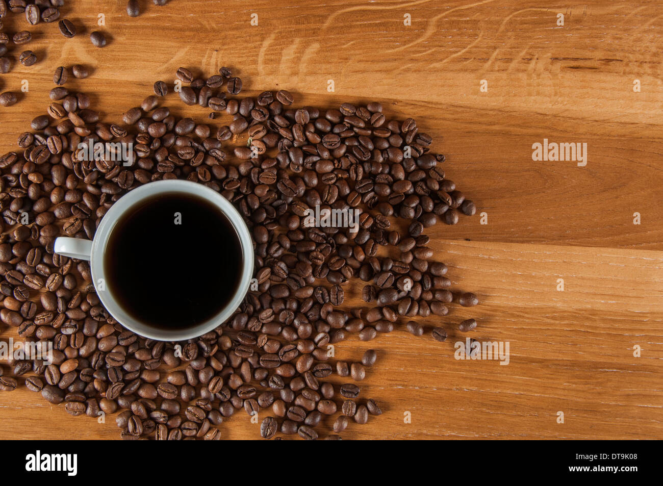 Coffee theme with wooden table and dark background Stock Photo - Alamy