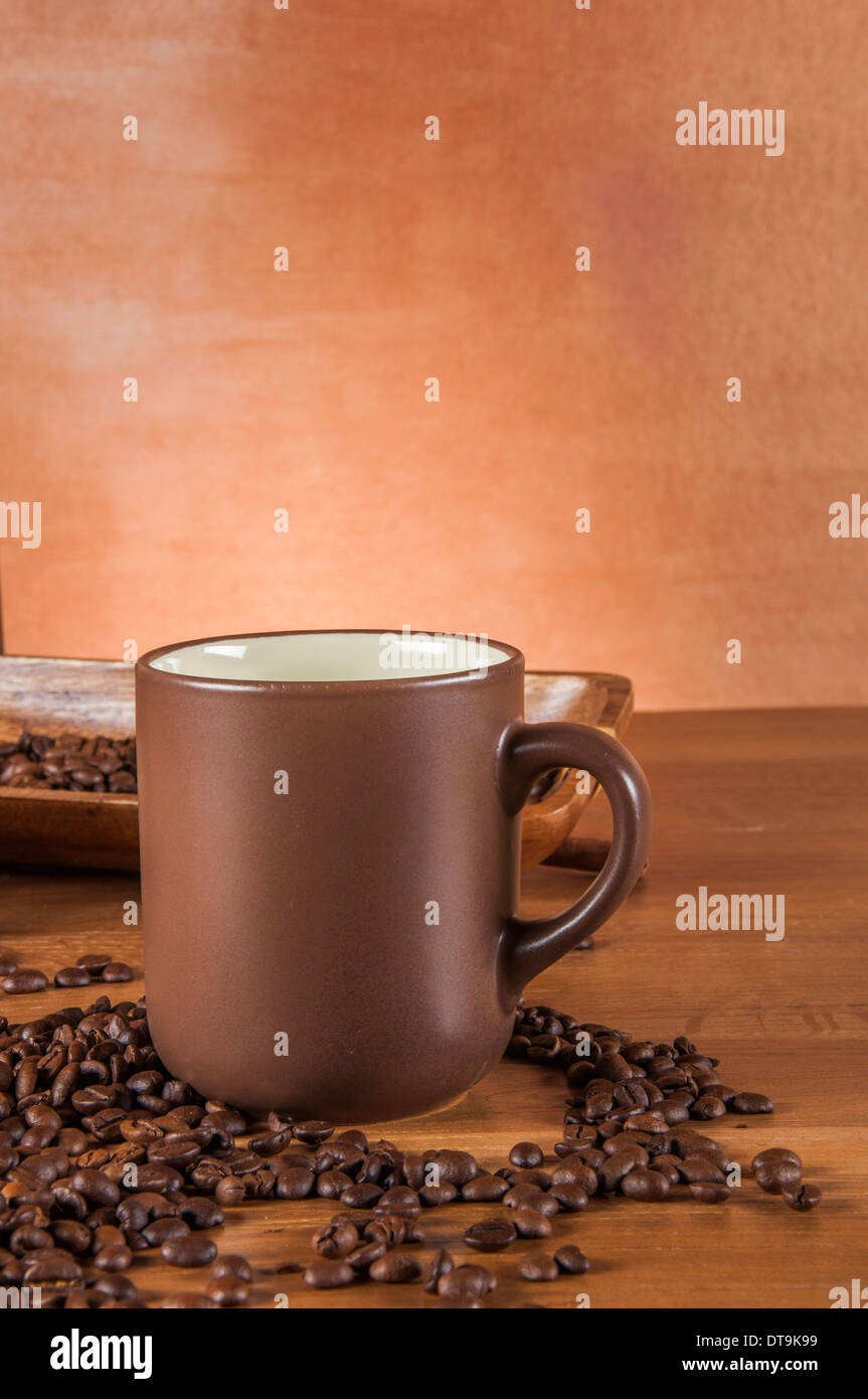 Coffee theme with wooden table and dark background Stock Photo - Alamy