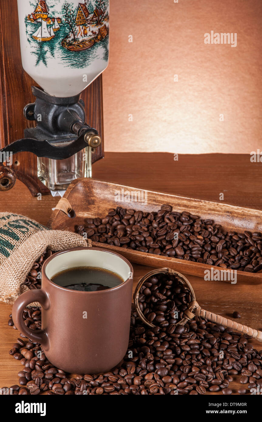 Coffee theme with wooden table and dark background Stock Photo - Alamy
