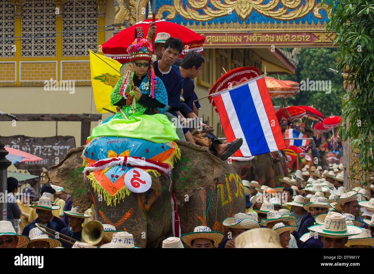 Initiates dressed in garish costumes and sunglasses in procession on ...