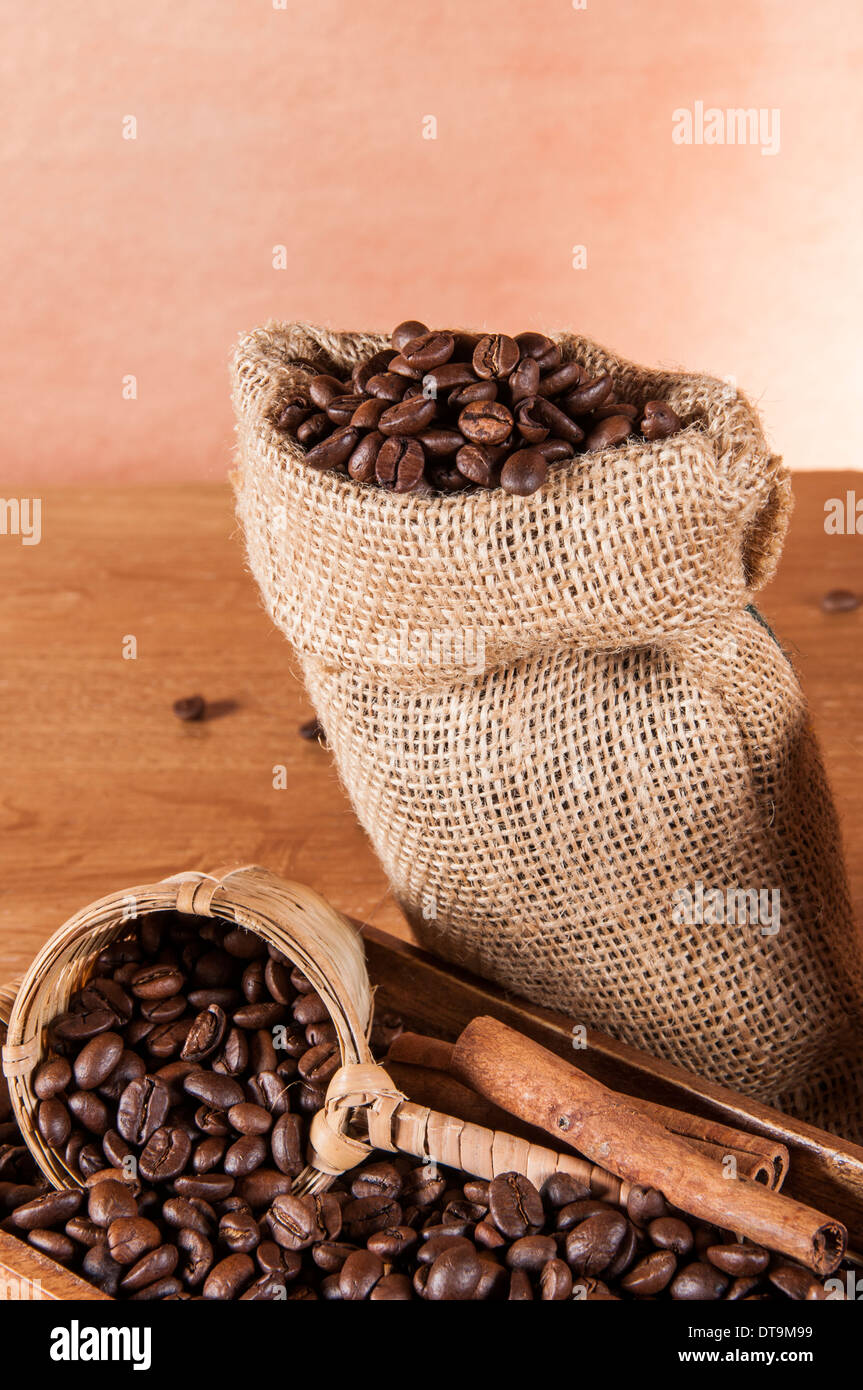 Coffee theme with wooden table and dark background Stock Photo - Alamy