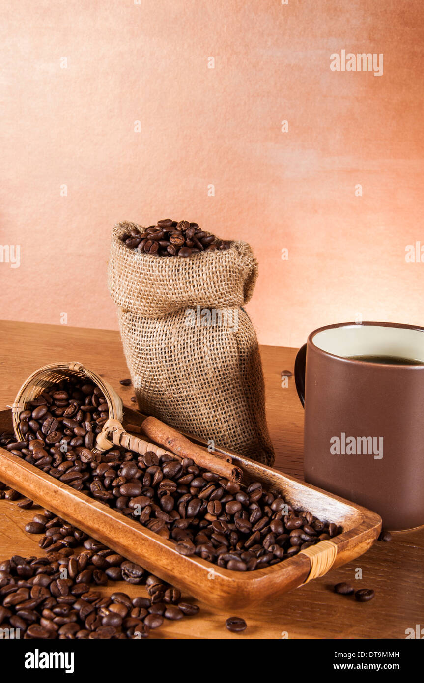 Coffee theme with wooden table and dark background Stock Photo - Alamy
