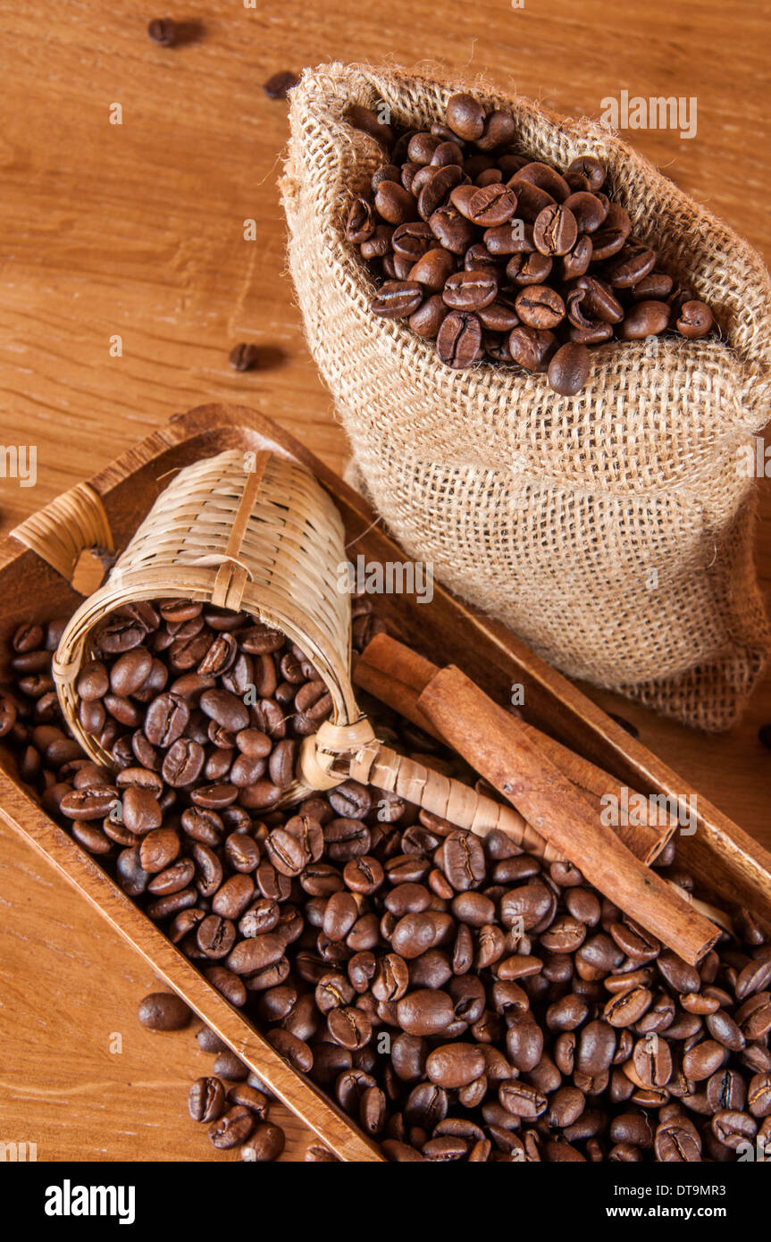 Coffee theme with wooden table and dark background Stock Photo - Alamy