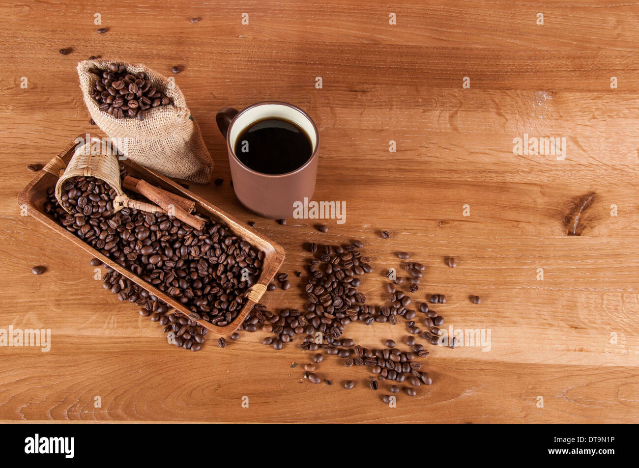 Coffee theme with wooden table and dark background Stock Photo - Alamy