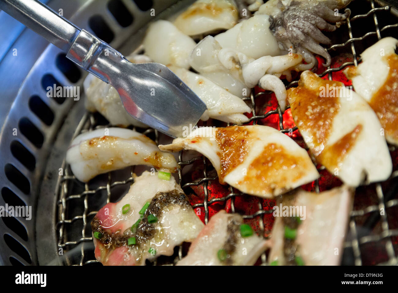 bacon Squid and Eringii Mushroom on a grill Stock Photo - Alamy