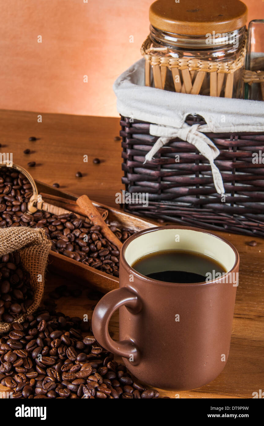 Coffee theme with wooden table and dark background Stock Photo - Alamy