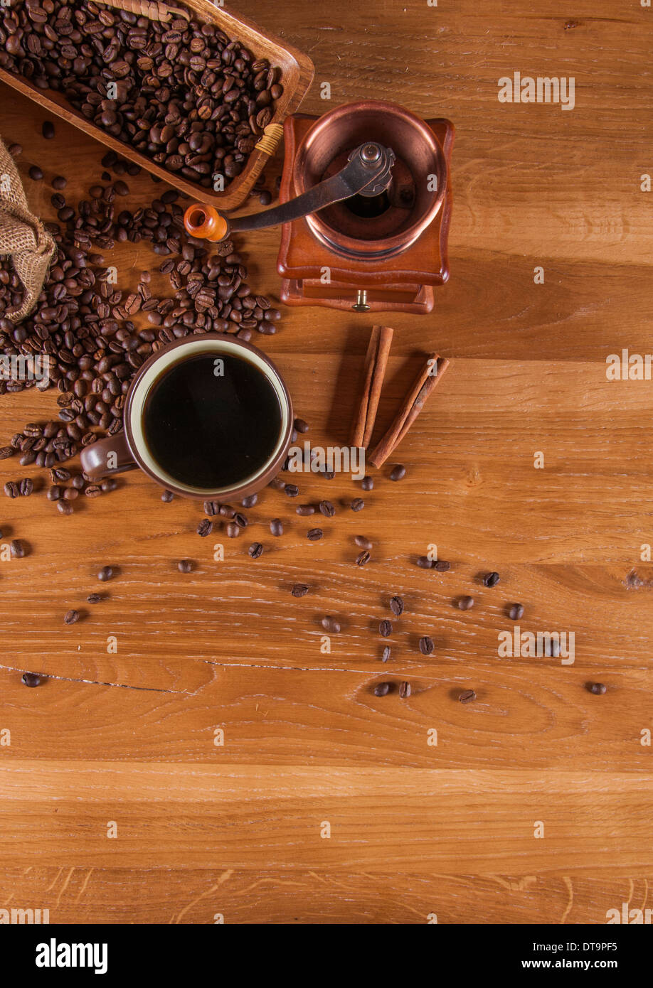 Coffee theme with wooden table and dark background Stock Photo - Alamy