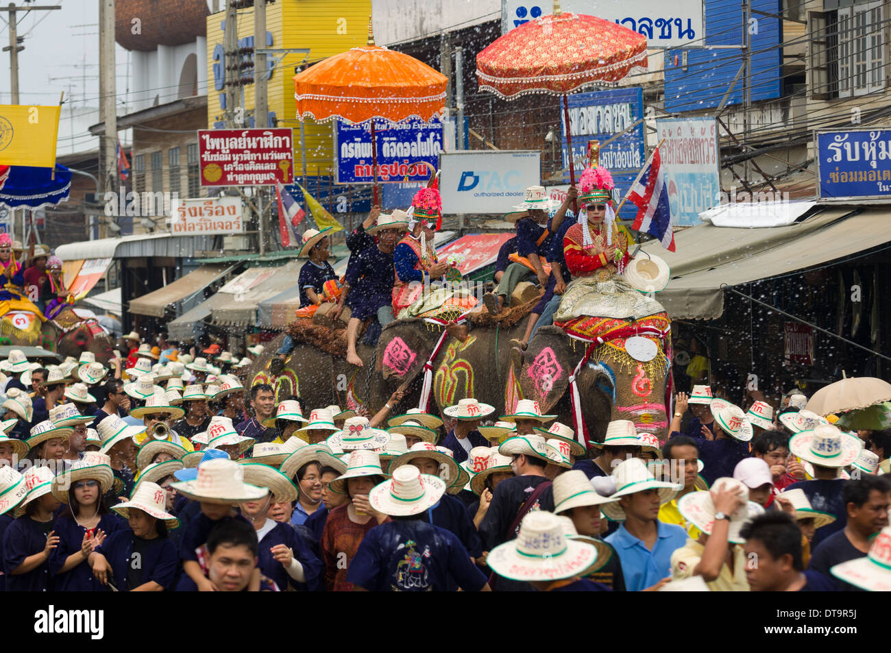 Initiates dressed in garish costumes and sunglasses in procession on ...
