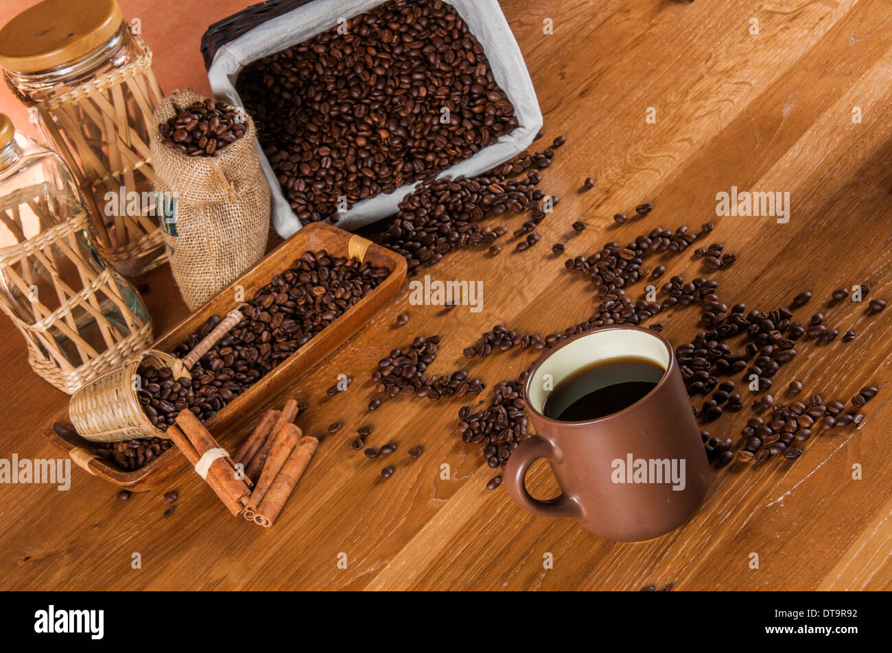 Coffee theme with wooden table and dark background Stock Photo - Alamy