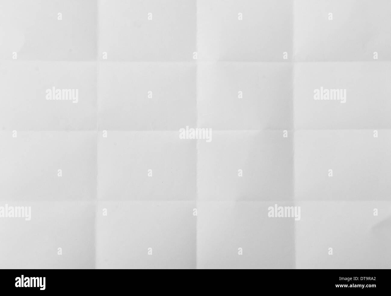 white textured sheet of paper folded in sixteen Stock Photo - Alamy