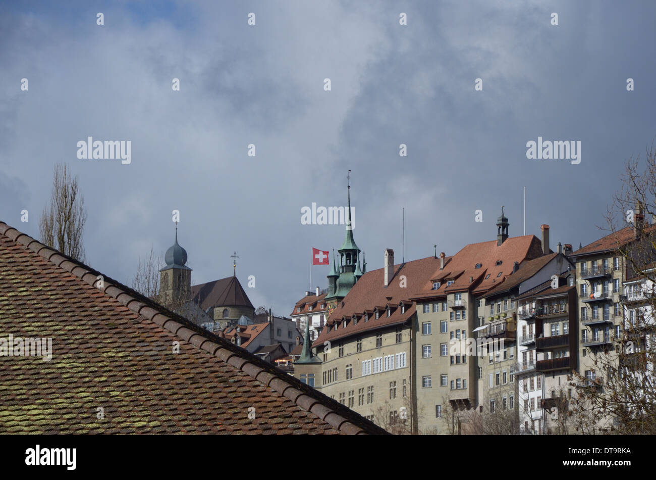 European rooftops with Swiss flag visible Stock Photo - Alamy