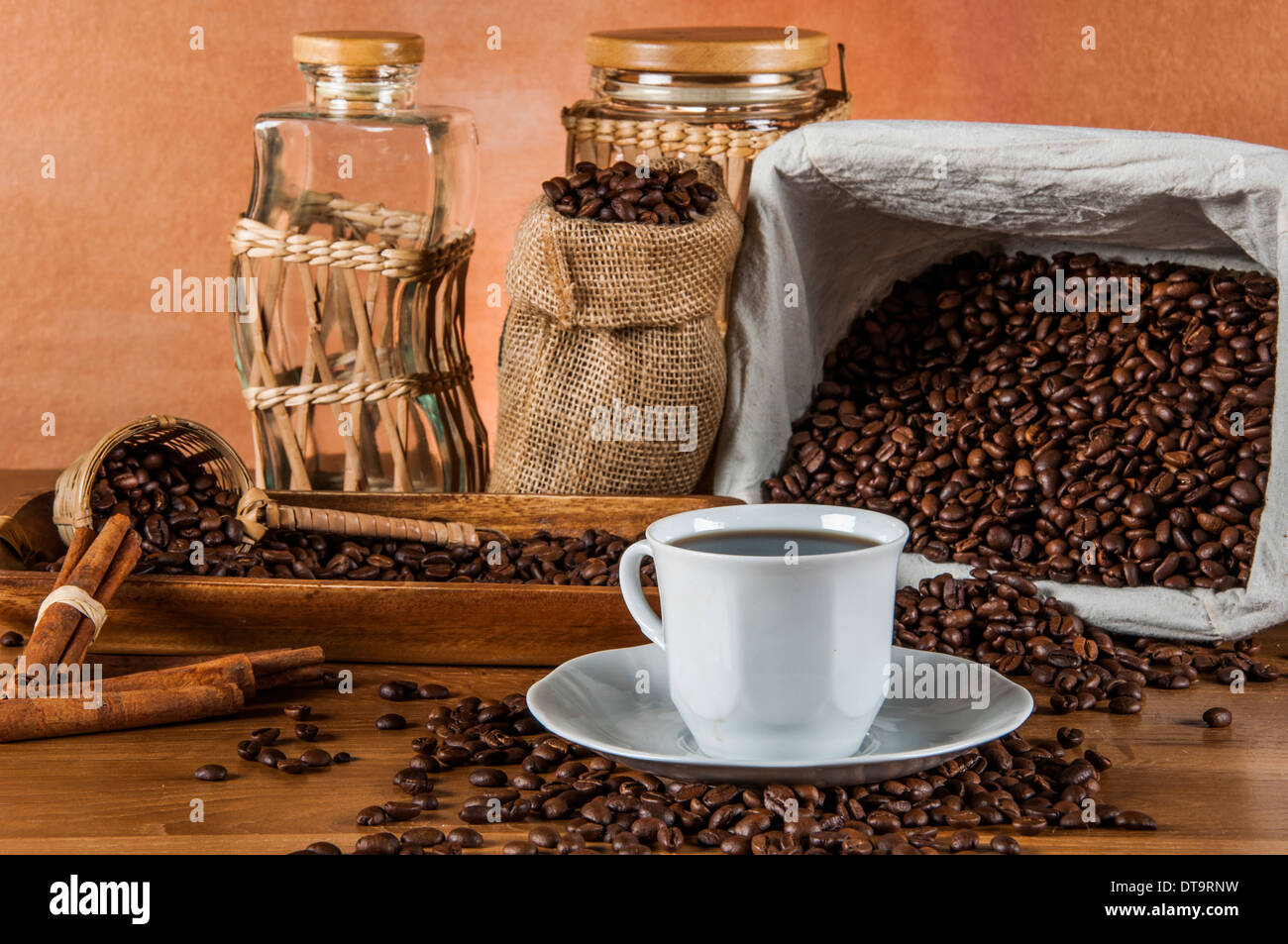 Coffee theme with wooden table and dark background Stock Photo - Alamy