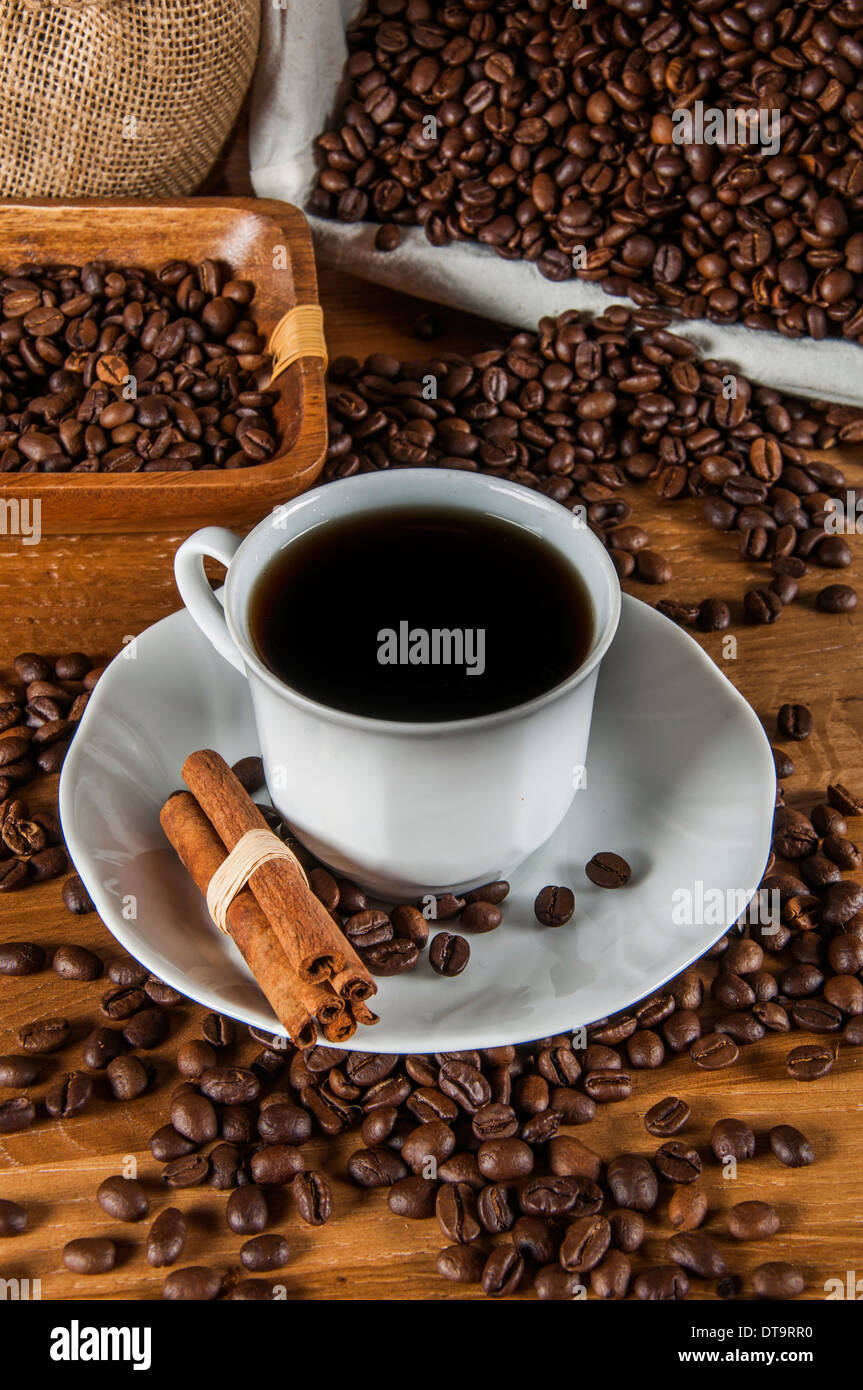 Coffee theme with wooden table and dark background Stock Photo - Alamy