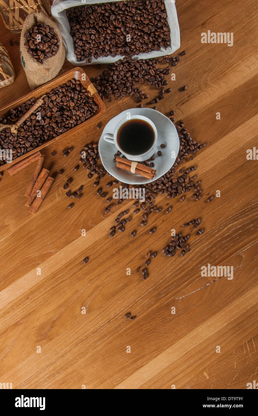 Coffee theme with wooden table and dark background Stock Photo - Alamy