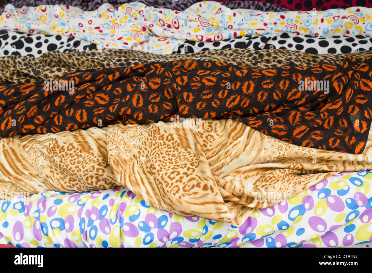 Stack of fabrics Galore for background Stock Photo - Alamy