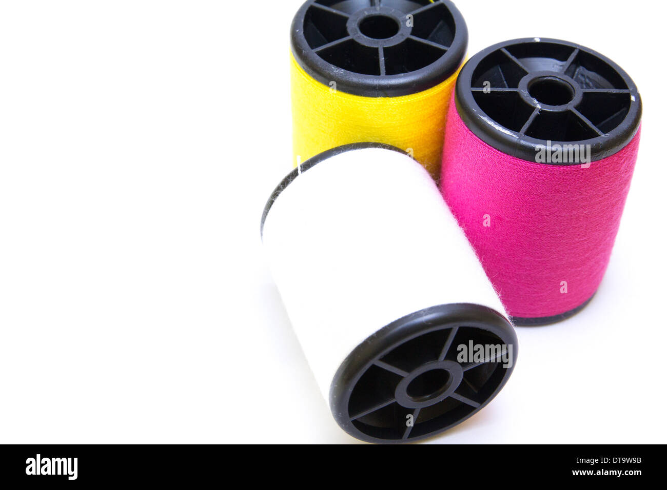 stack of coloured sewing thread Stock Photo - Alamy