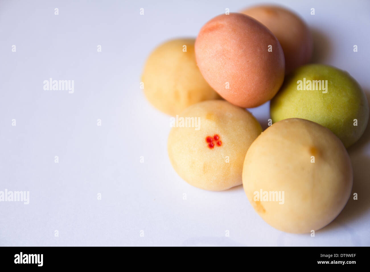 Mochi colorful japanese rice cakes stacked on white background ...