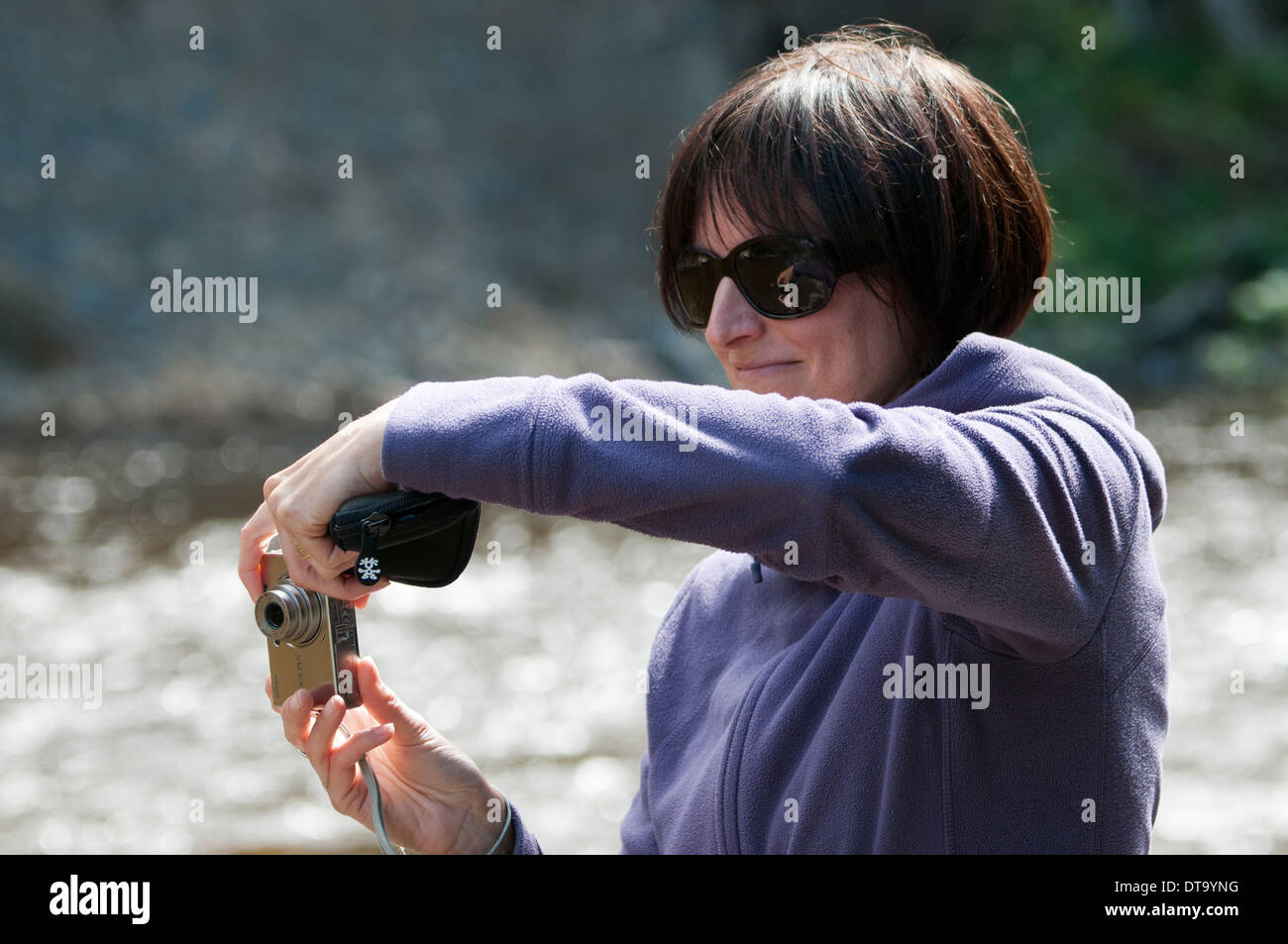 Woman taking picture Stock Photo - Alamy