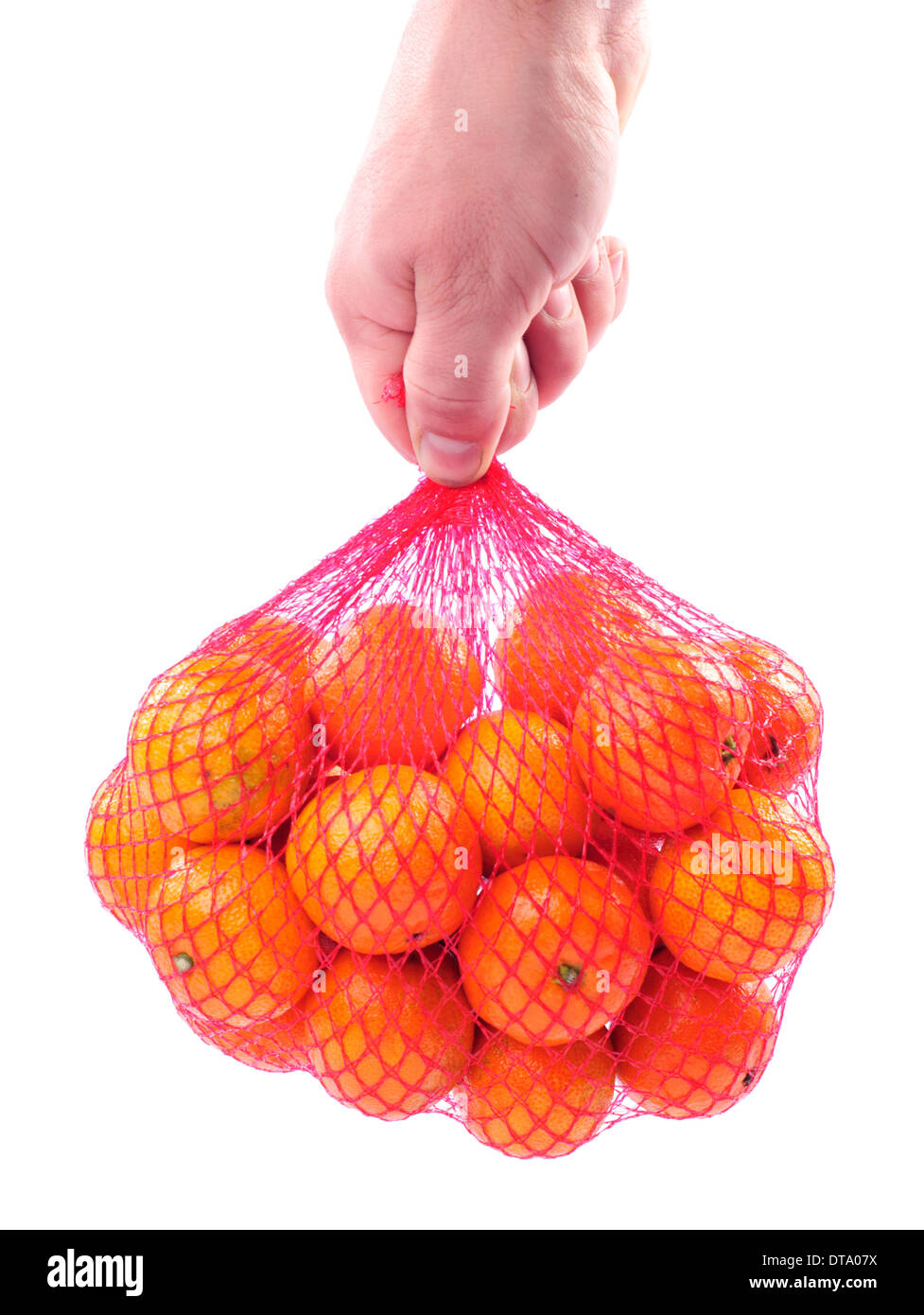 Hand holding a bag of tangerines isolated on white background Stock ...