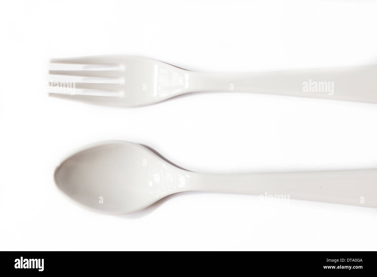 A set of plastic silverware, isolated on white Stock Photo - Alamy