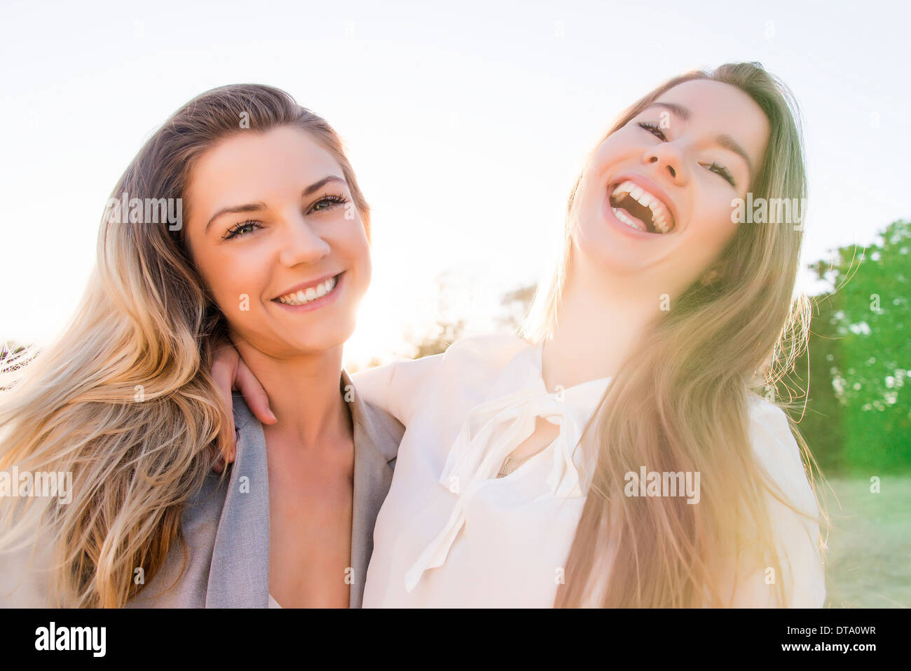 2 young women laughing hi-res stock photography and images - Alamy