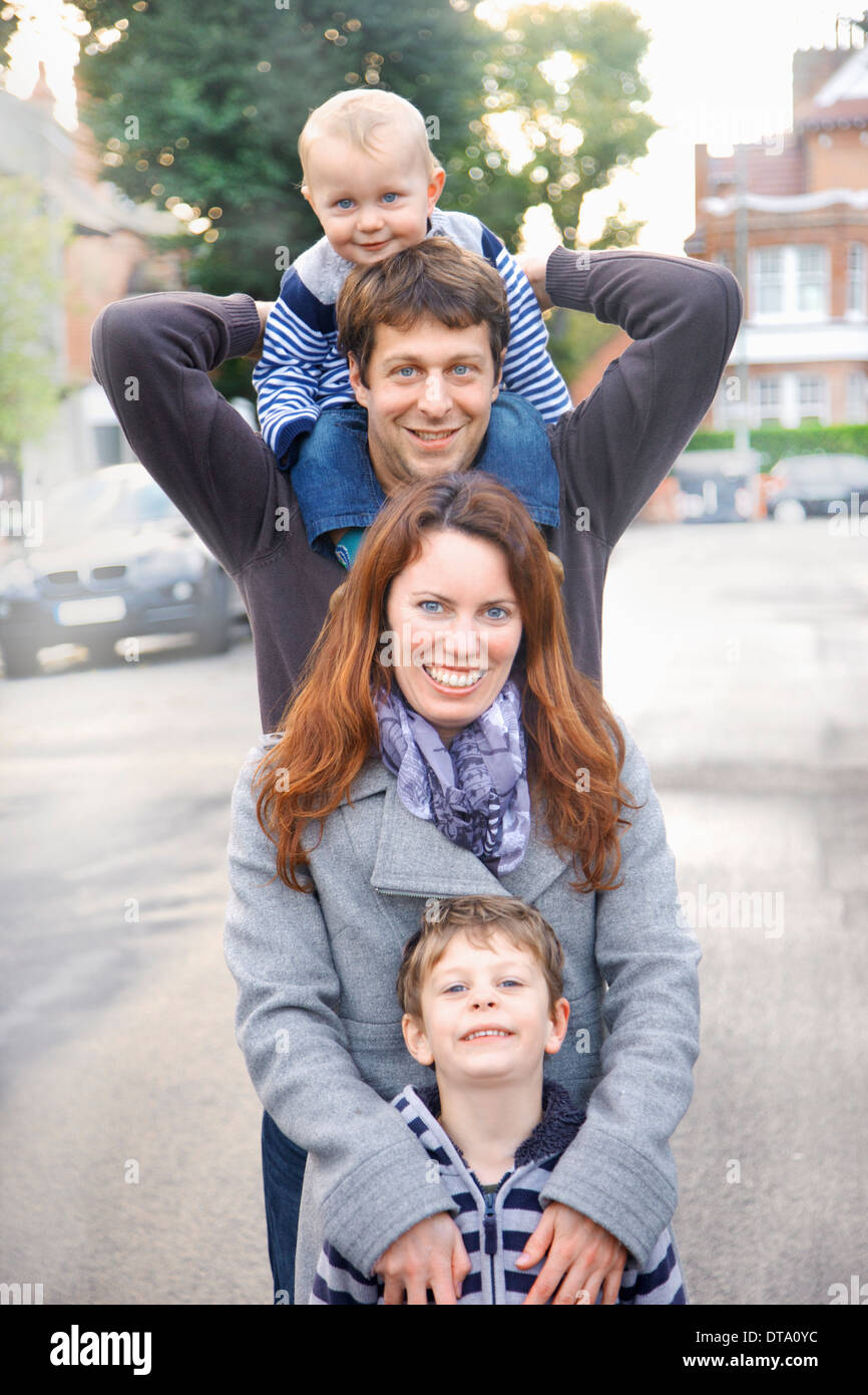 Father standing behind son hi-res stock photography and images - Alamy