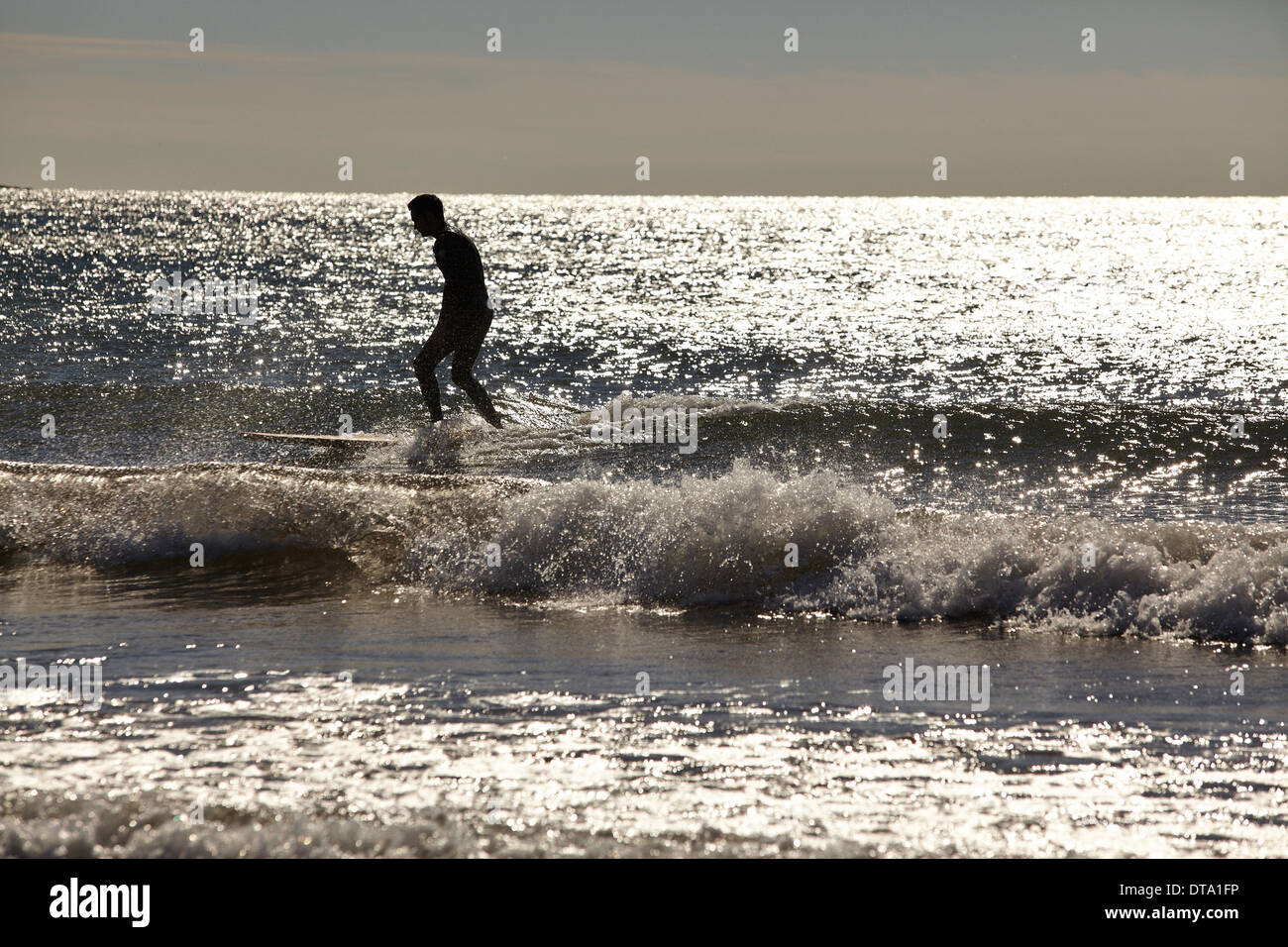 Surfer riding wave hi-res stock photography and images - Alamy