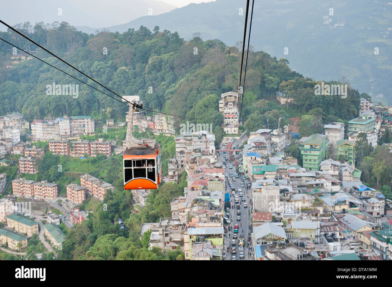 Gondola of a cable car and the town of Gangtok, aerial view, Sikkim ...