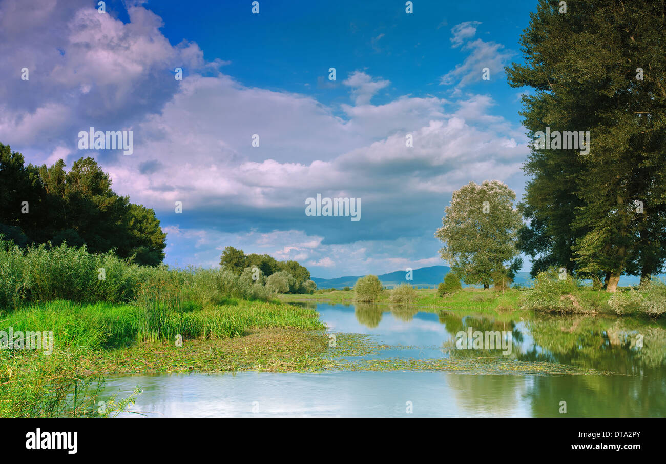 River landscape with sunset and reflection Stock Photo - Alamy