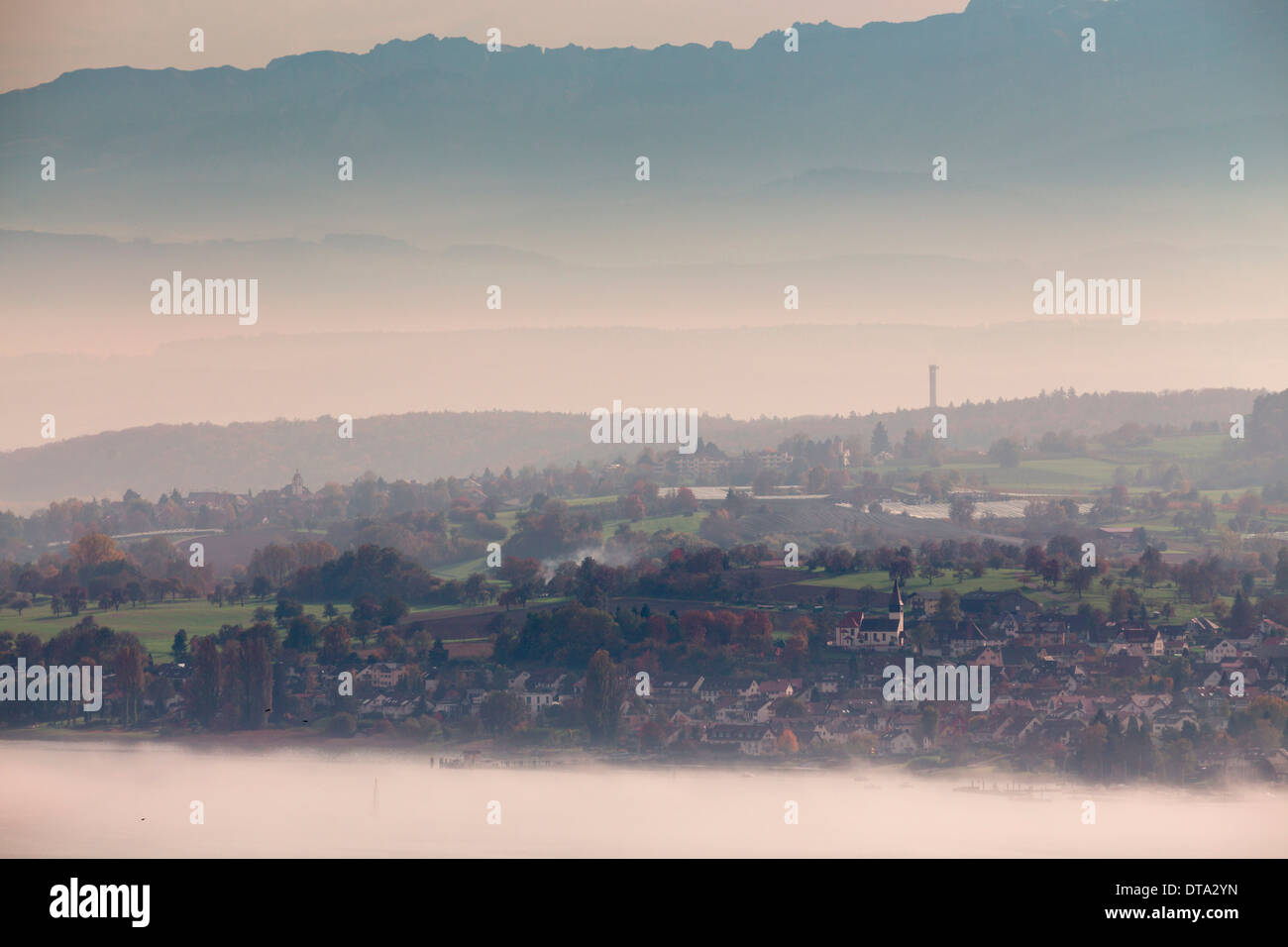 Fog over Überlingersee lake and Dingelsdorf, Alpstein Massif at the ...