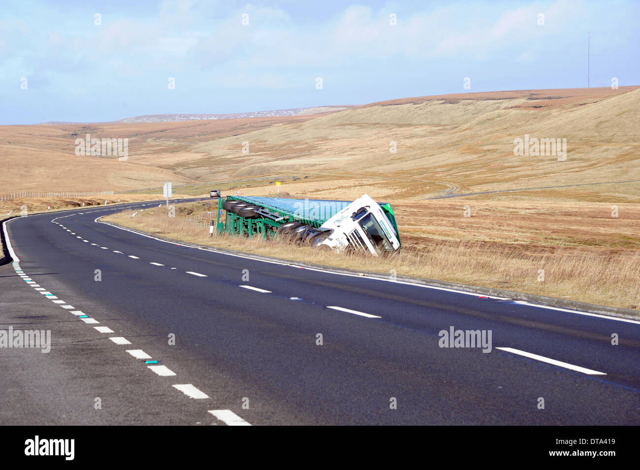 Woodhead Pass, UK. 13th Feb, 2014. An overturned lorry on the A628 ...