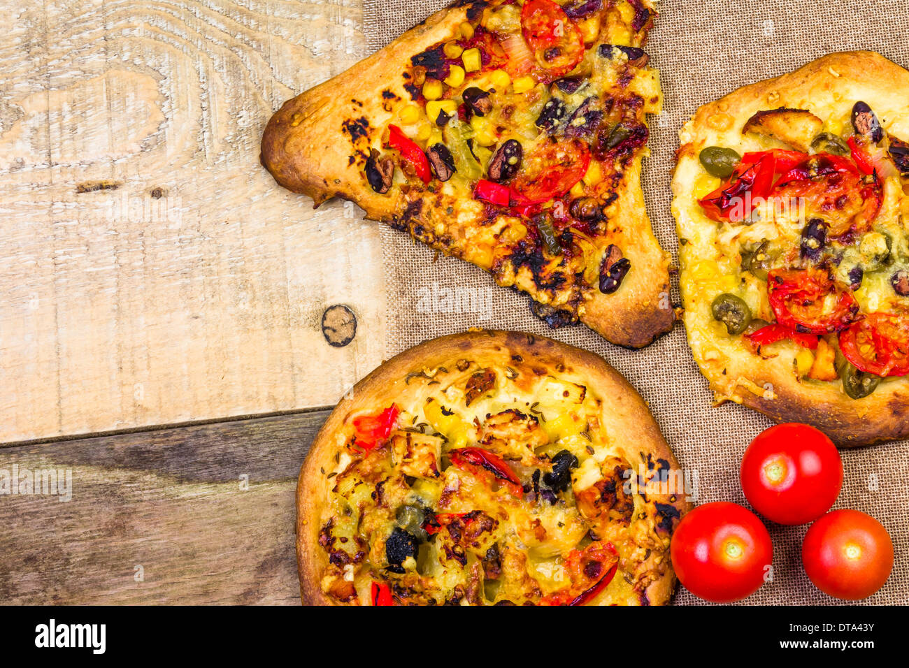 Closeup of a heavily toasted slices of pizza Stock Photo - Alamy