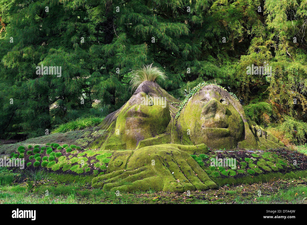 Stone statues overgrown with moss, Mainau, Baden-Württemberg, Germany ...