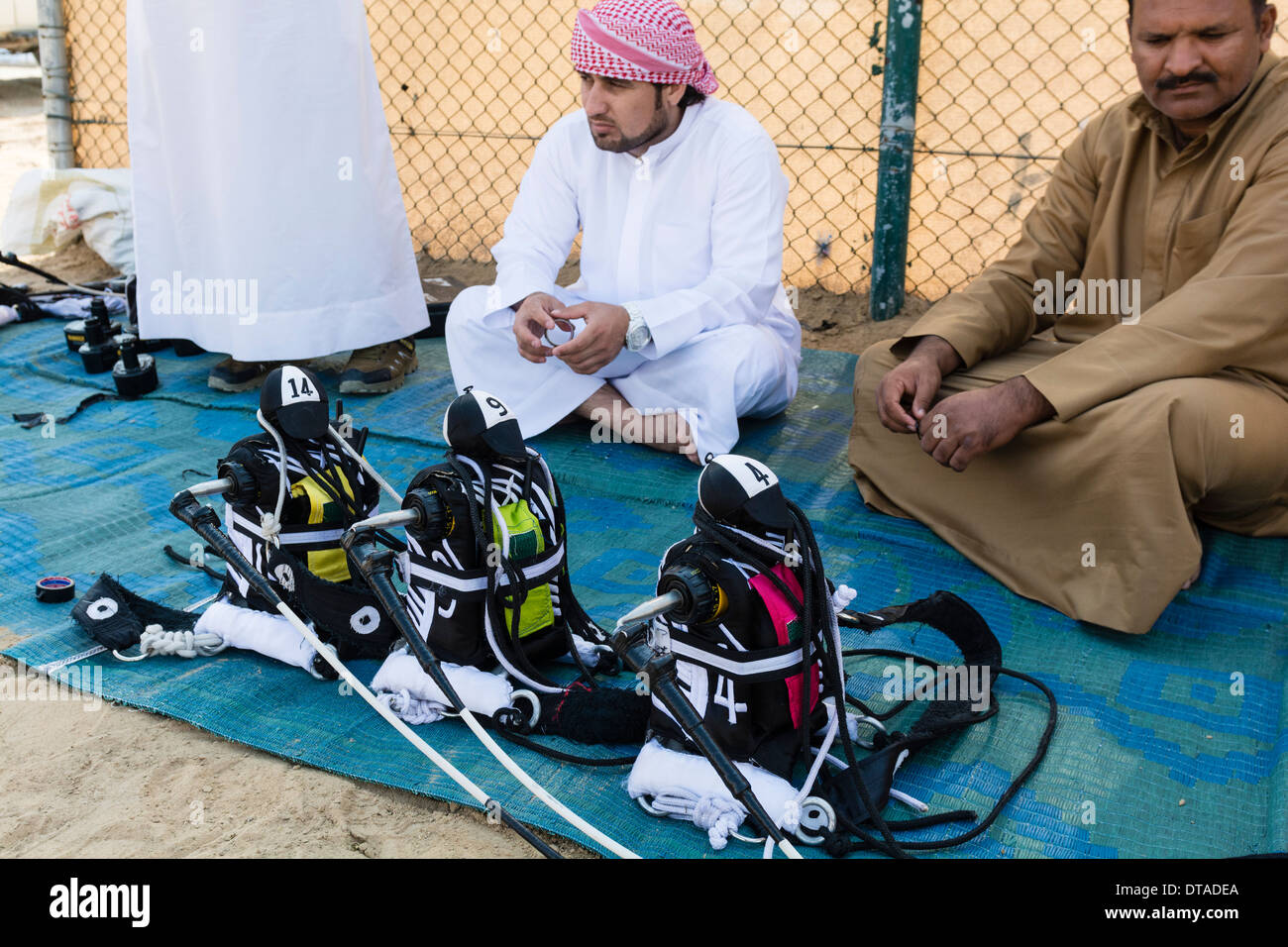 Robot remote controlled jockeys for sale at camel racing club at Al ...
