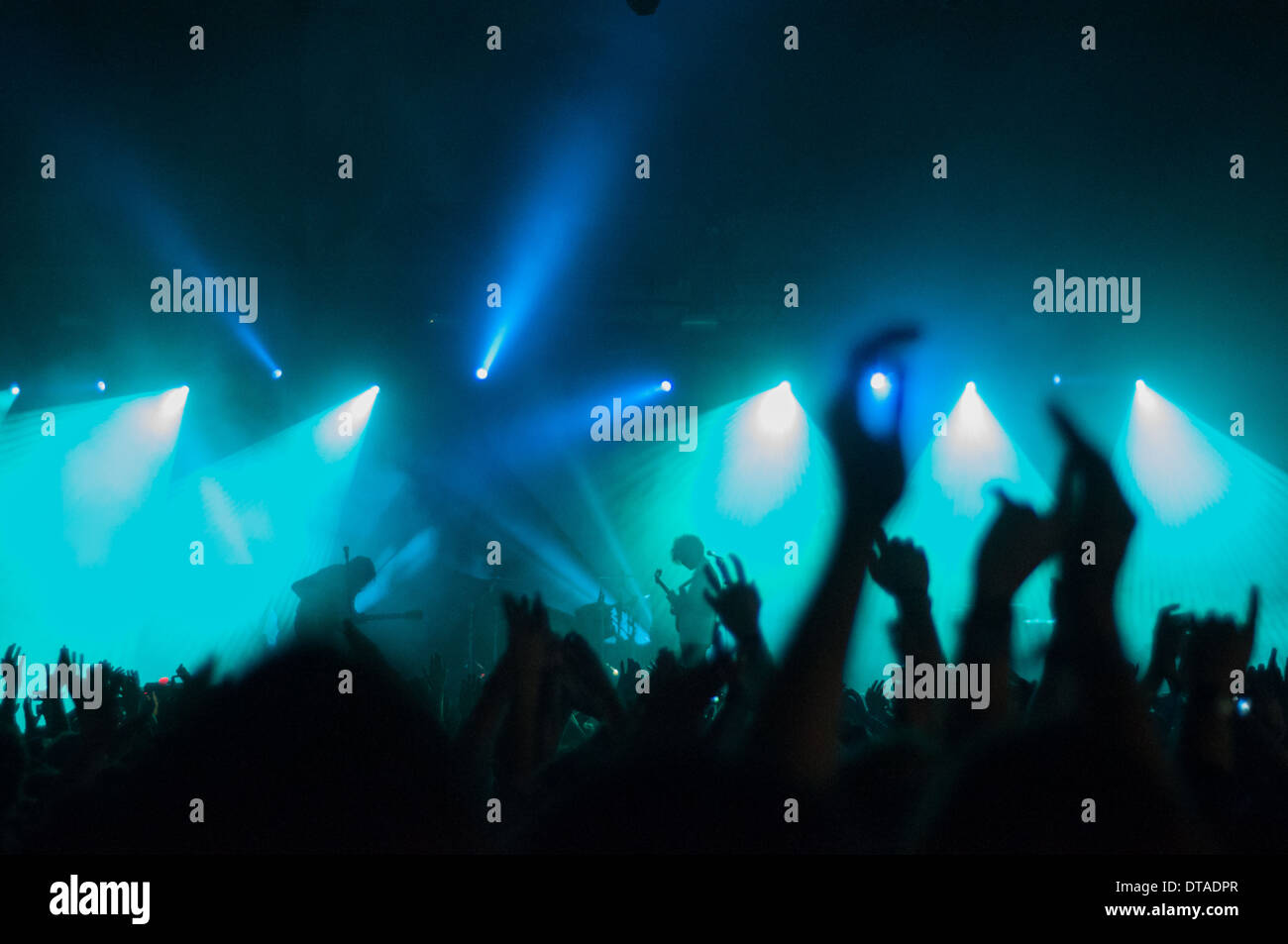Audience wave hands in air at rock concert Stock Photo - Alamy