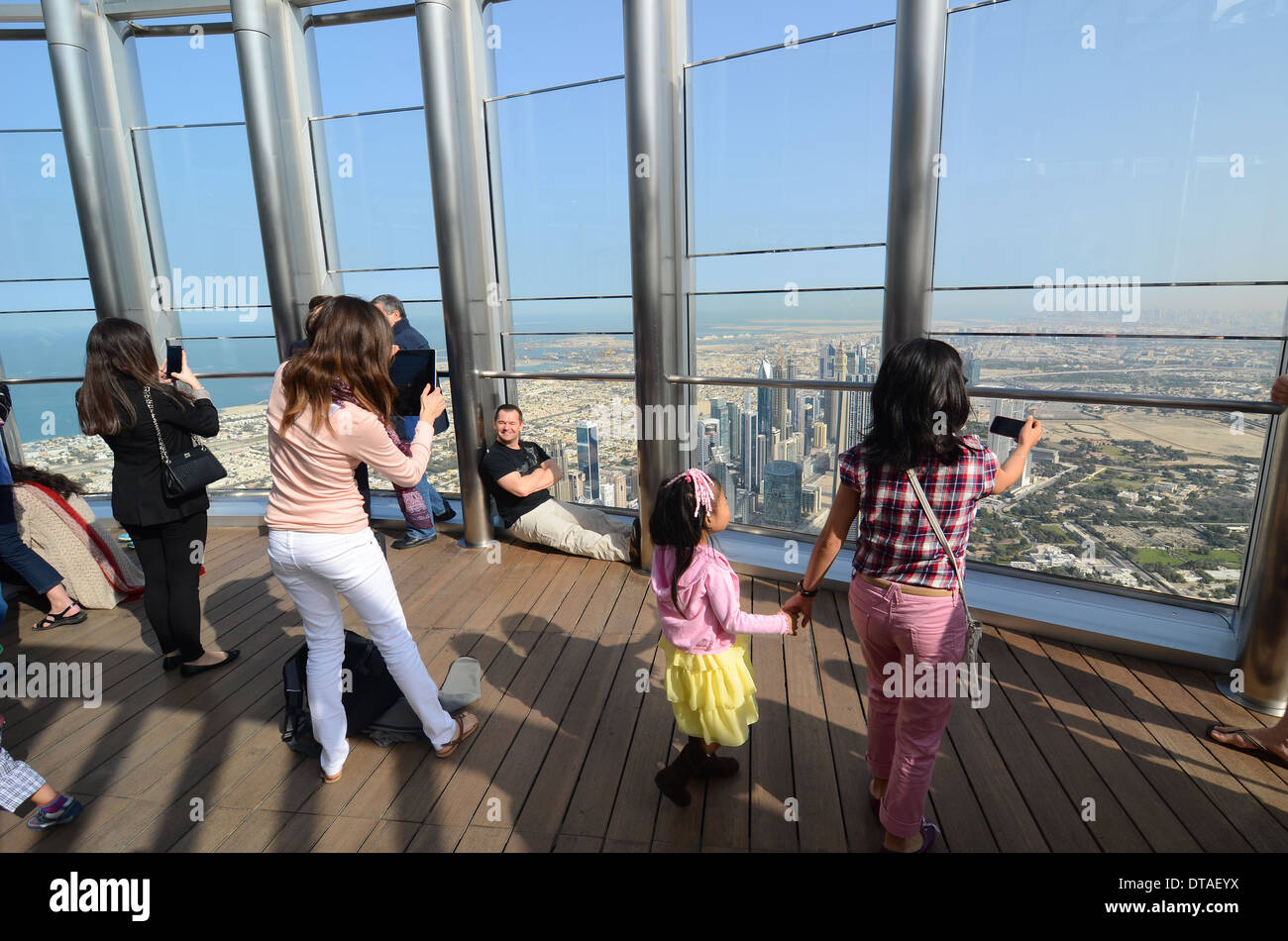 Visitors on the observation deck of Dubai's Burj Khalifa – the world's tallest building – in the ...