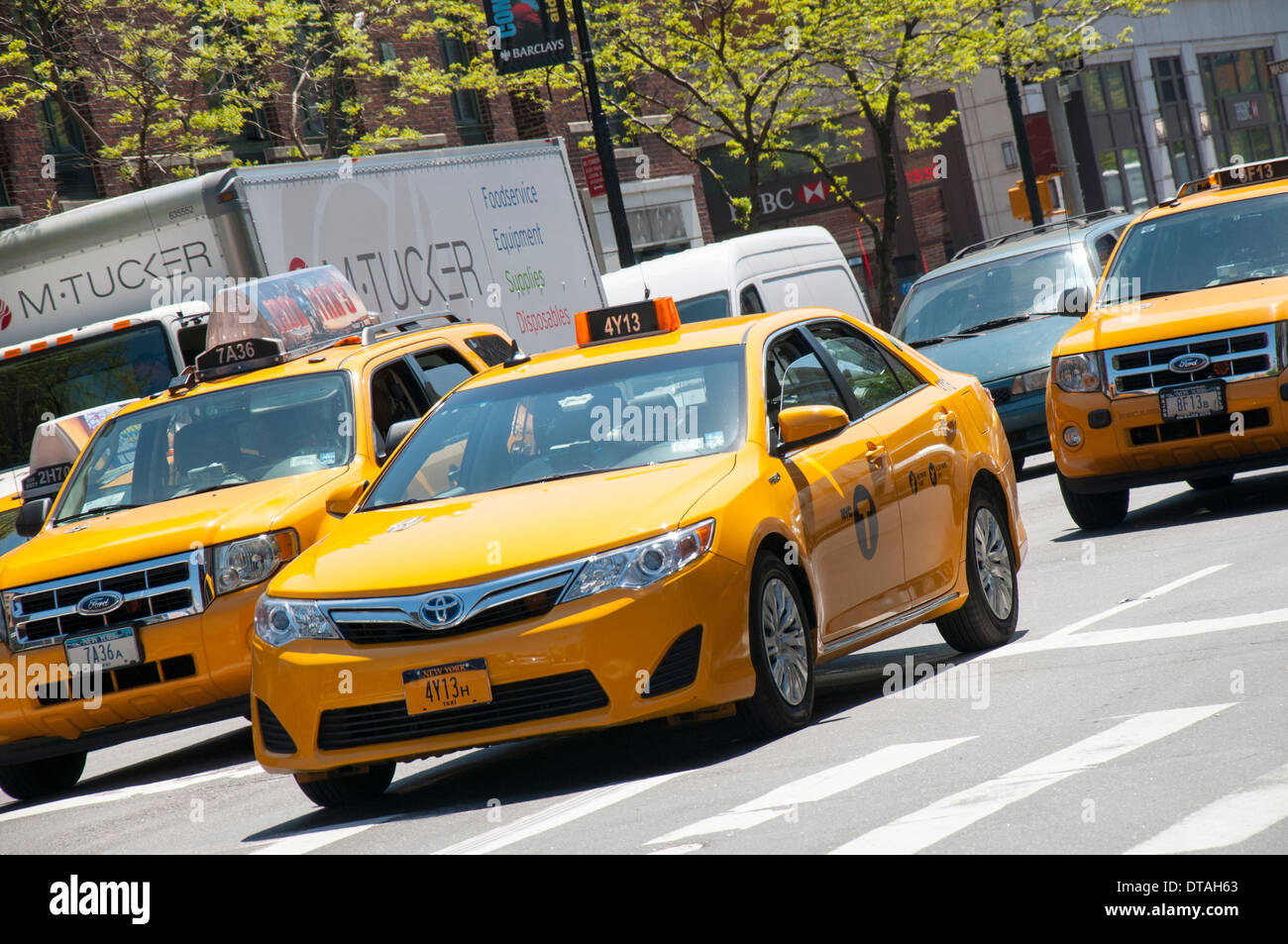 Yellow cabs on the Avenue of the Americas in Manhattan New York City ...