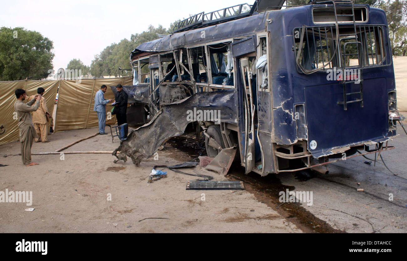 Karachi. 13th Feb, 2014. The wreckage of a destroyed police bus is seen ...