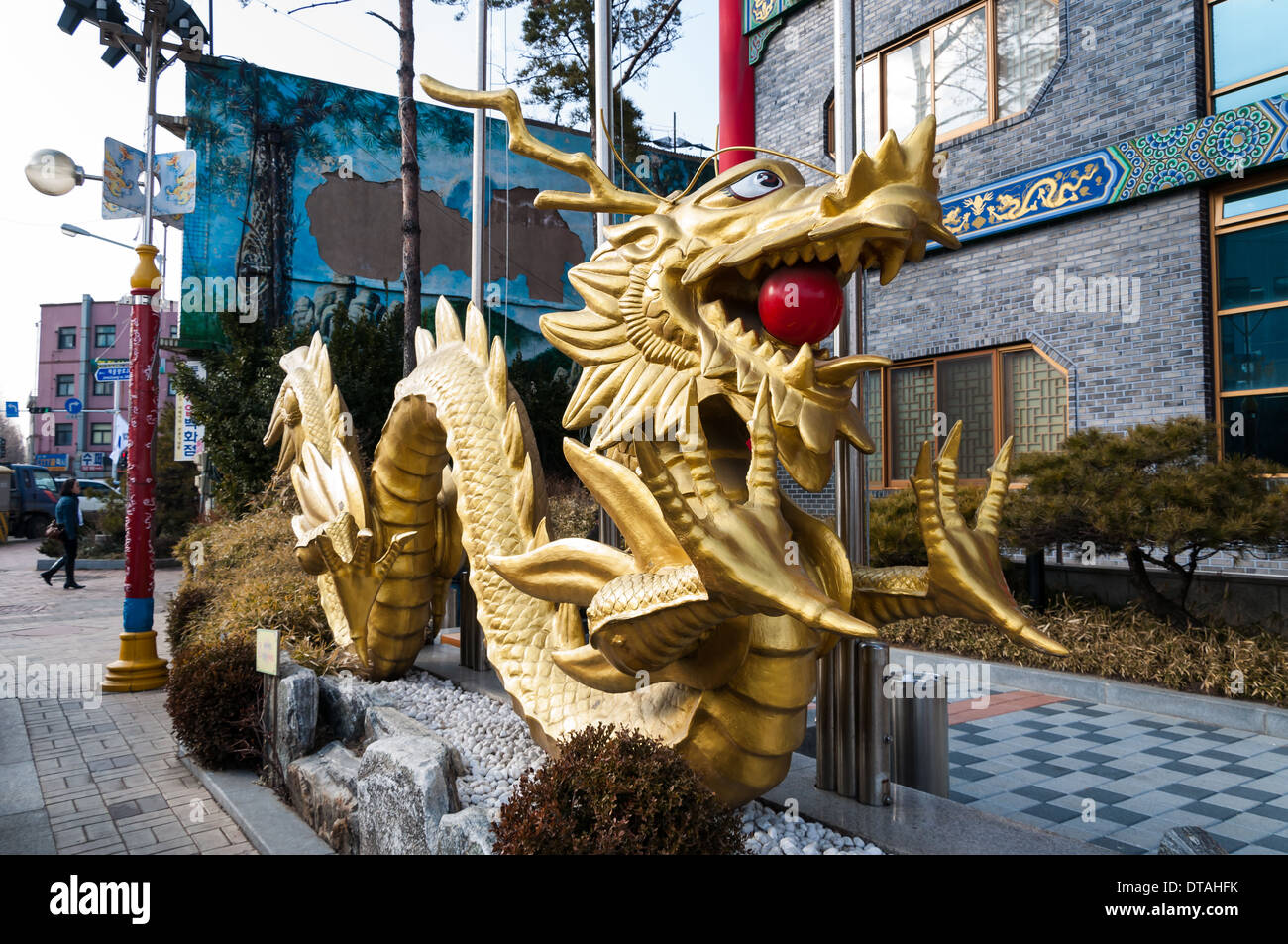Golden dragon statue outside of a building in the Chinatown district of ...