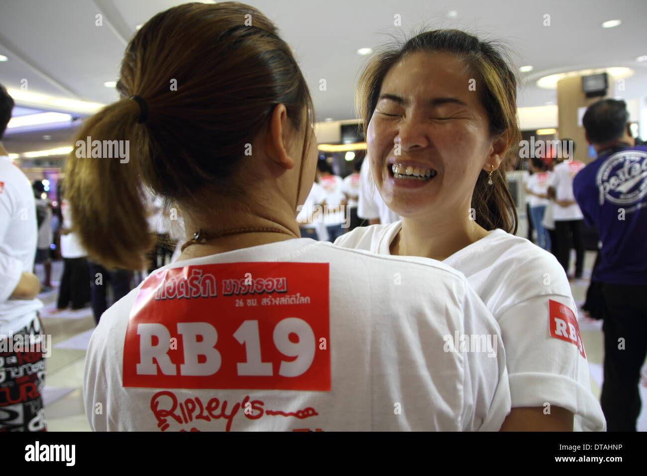 Pattaya, Thailand. 13 February 2014. Thai and foreign couples hug ...