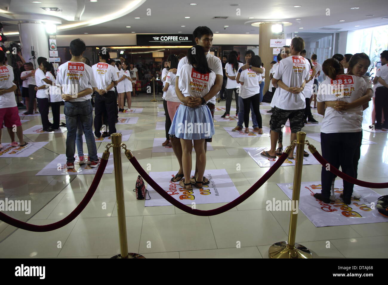 Pattaya, Thailand. 13 February 2014. Thai and foreign couples hug ...