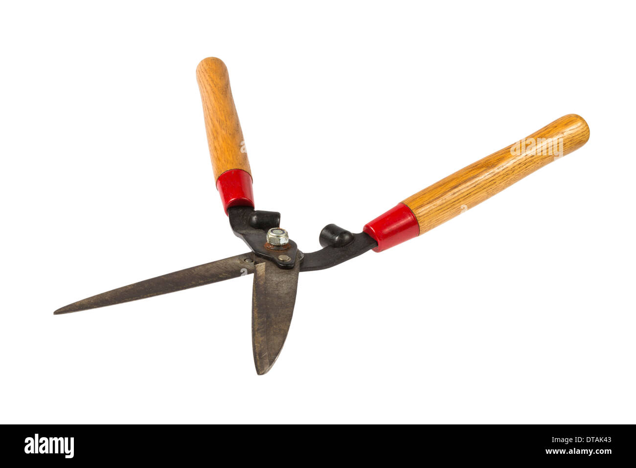 Used manual hedge clippers with black blades and wooden handles ...