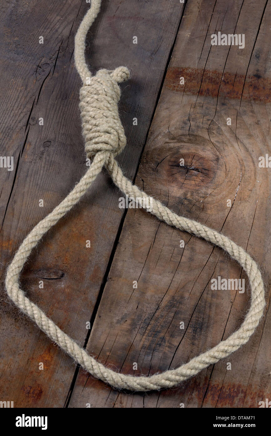 Rope with hangman's noose on wooden background Stock Photo - Alamy