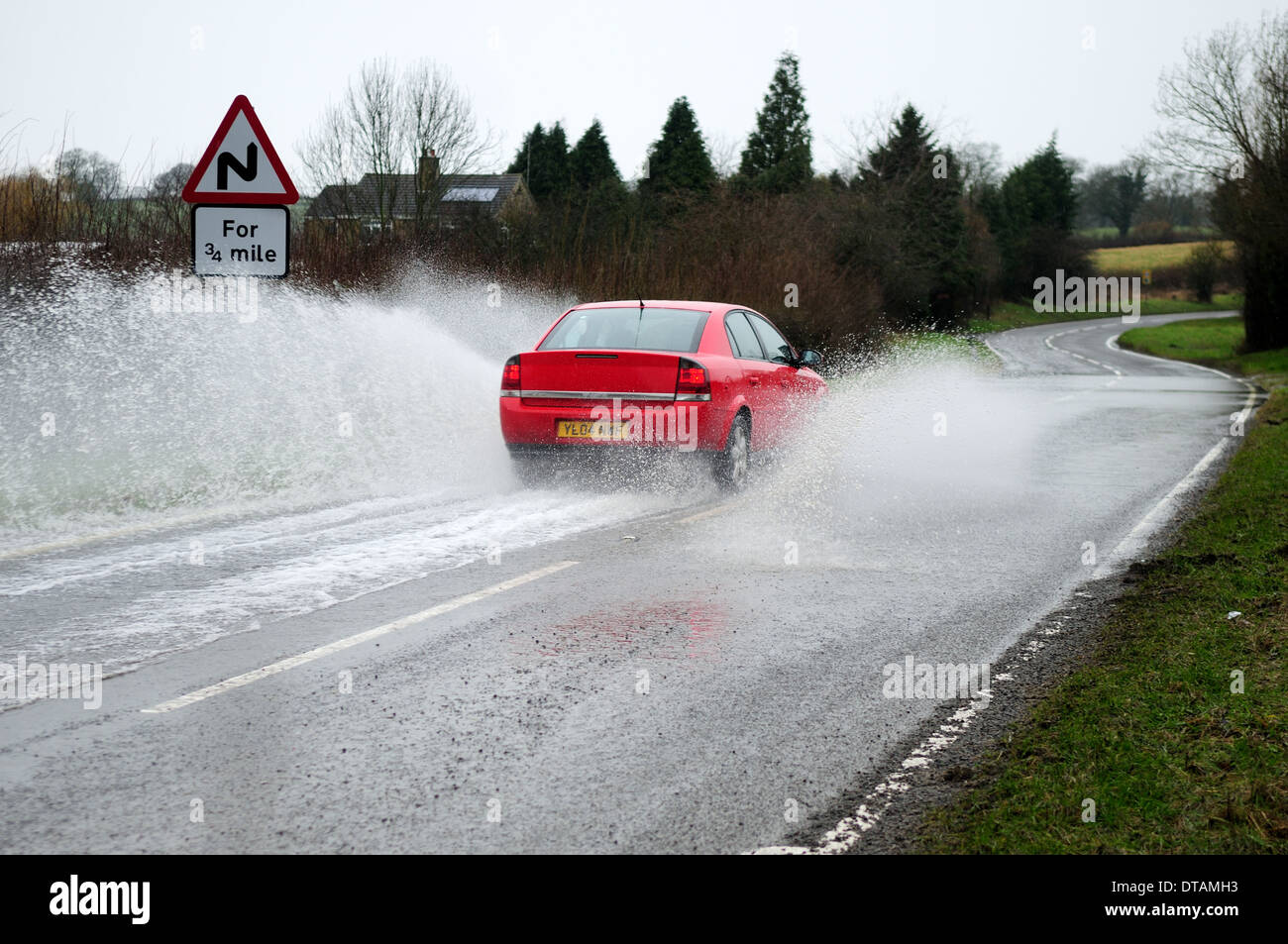 Car Drive Through Flooded Road Stock Photo - Alamy