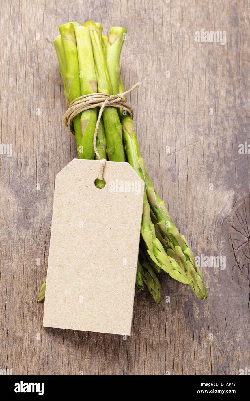 bunch of green asparagus tied with twine and tag, rustic style for ...
