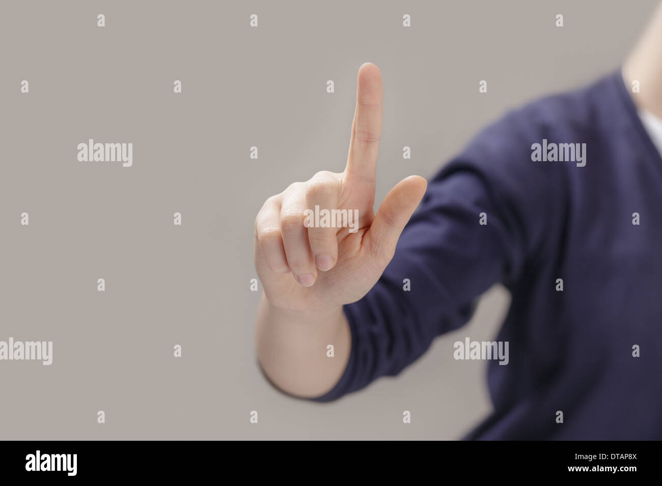 young female hand to select or touch something on transparent screen ...