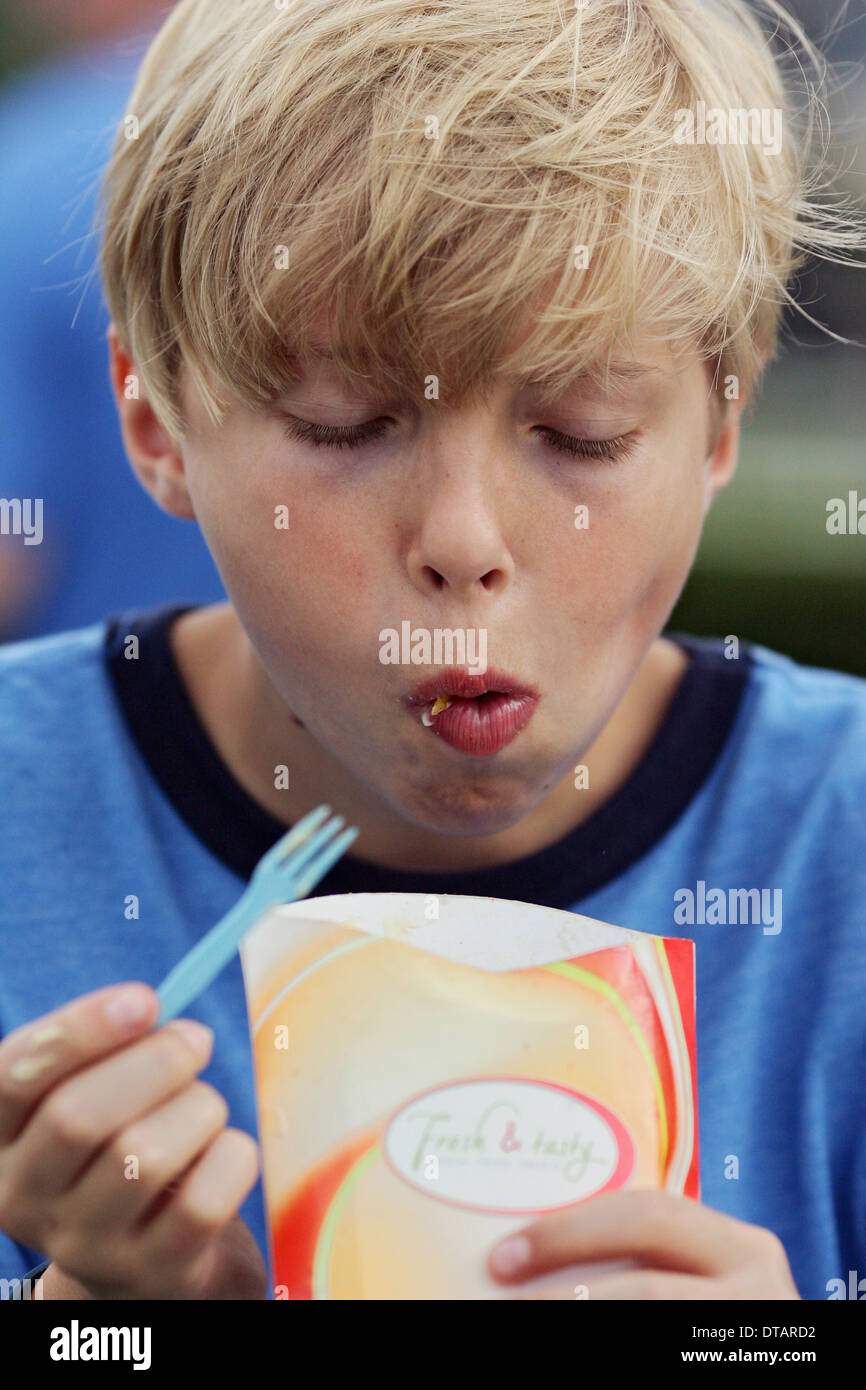 Hamburg, Germany, boy eating fast food Stock Photo - Alamy