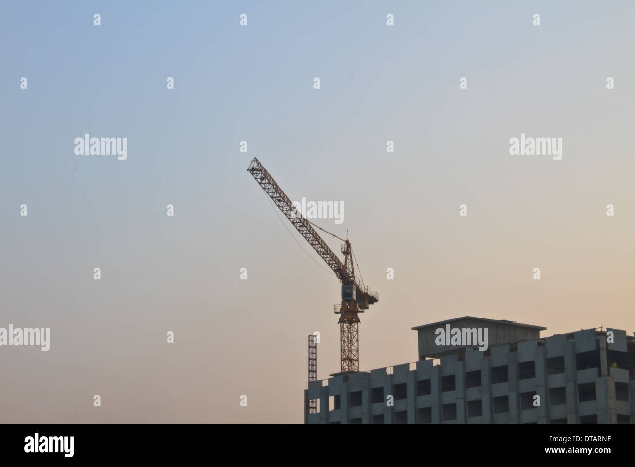 Construction site on sunset background Stock Photo - Alamy