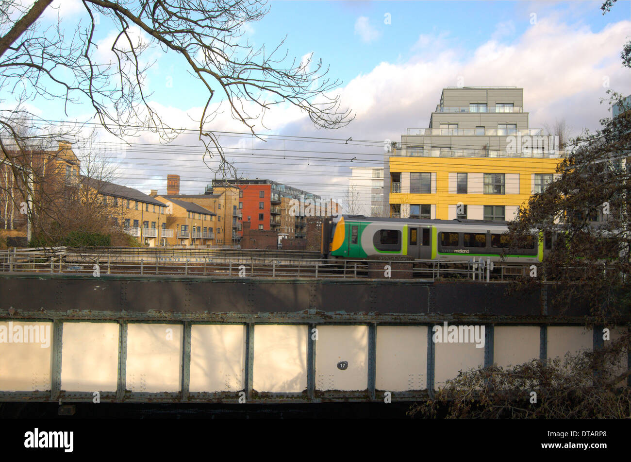 London Midland commuter electric multiple unit (EMU) train crossing the ...