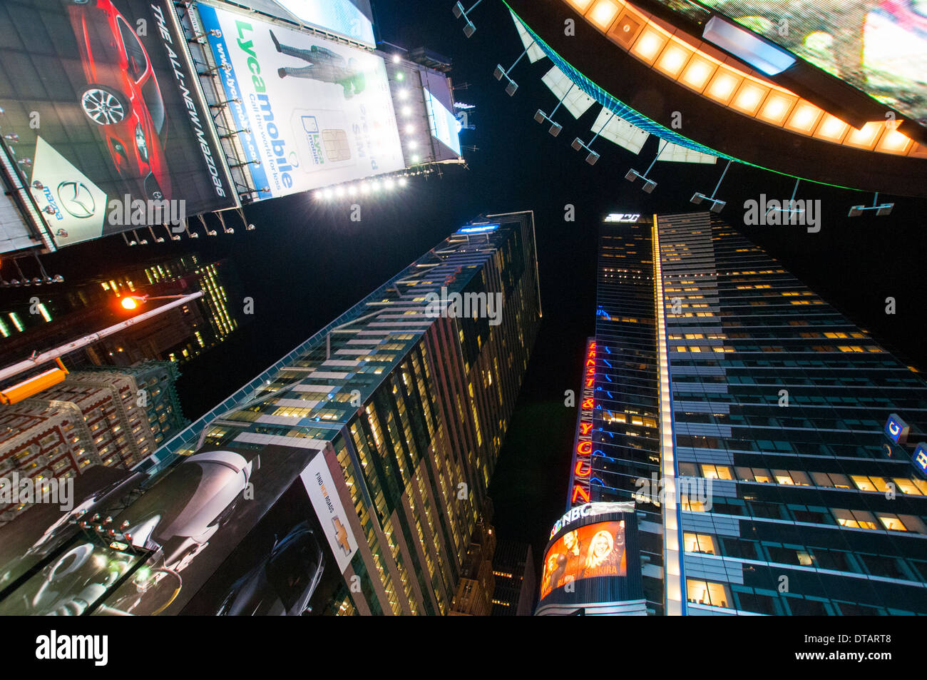 Looking up at Times Square by night, Midtown Manhattan New York City ...